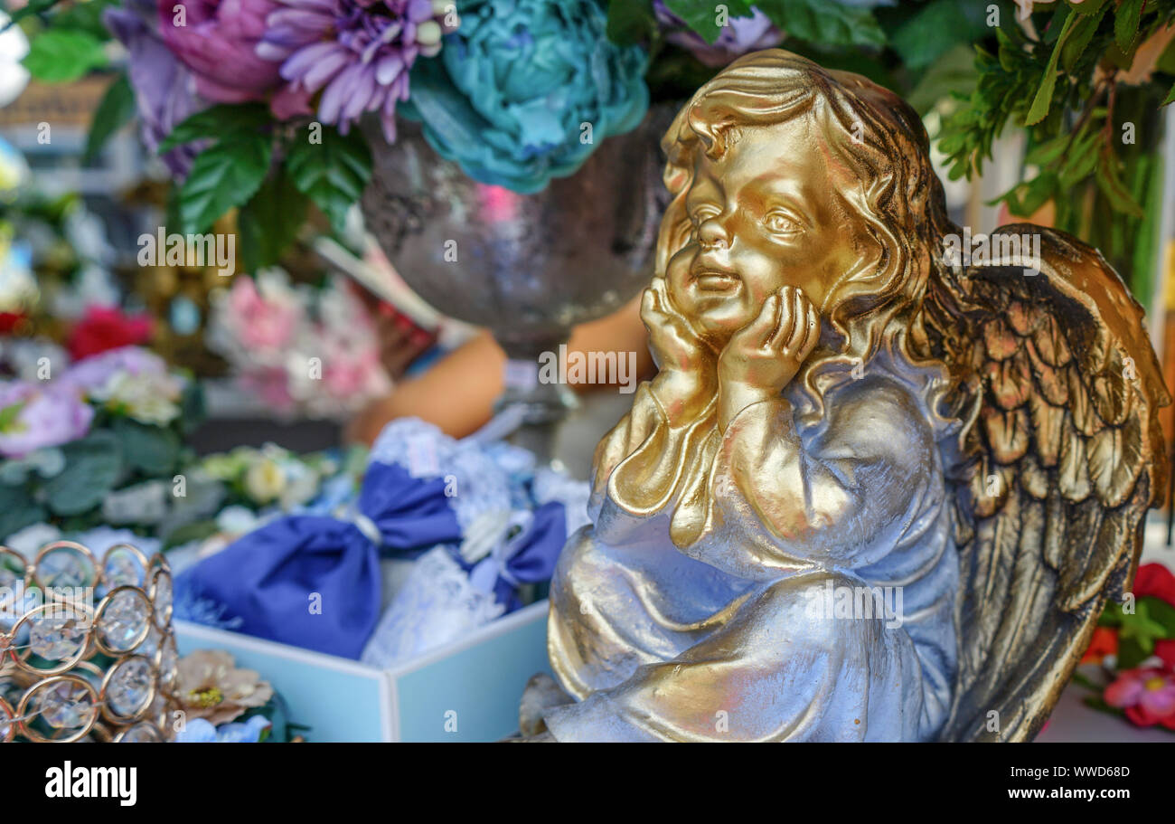 The gilded figure of an angel with wings Stock Photo - Alamy
