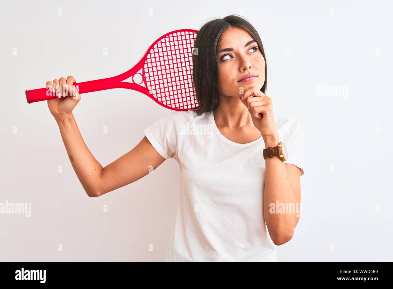 Beautiful sportswoman playing tennis using racket standing over ...