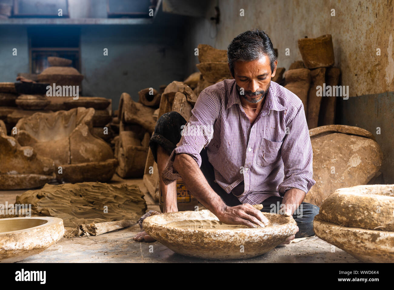 Local artisan working on clay pottery in Goa,India Stock Photo - Alamy