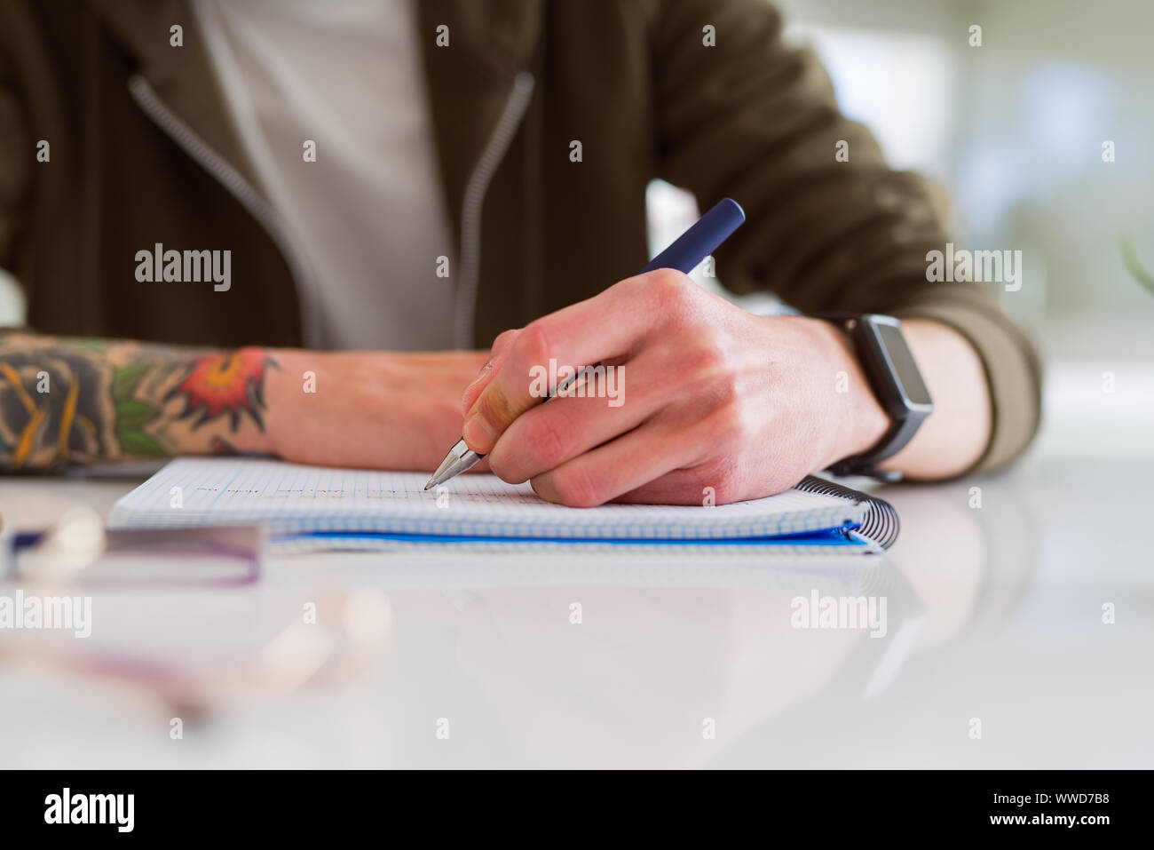 Close up of man hands writing on notebook, working taking notes Stock ...