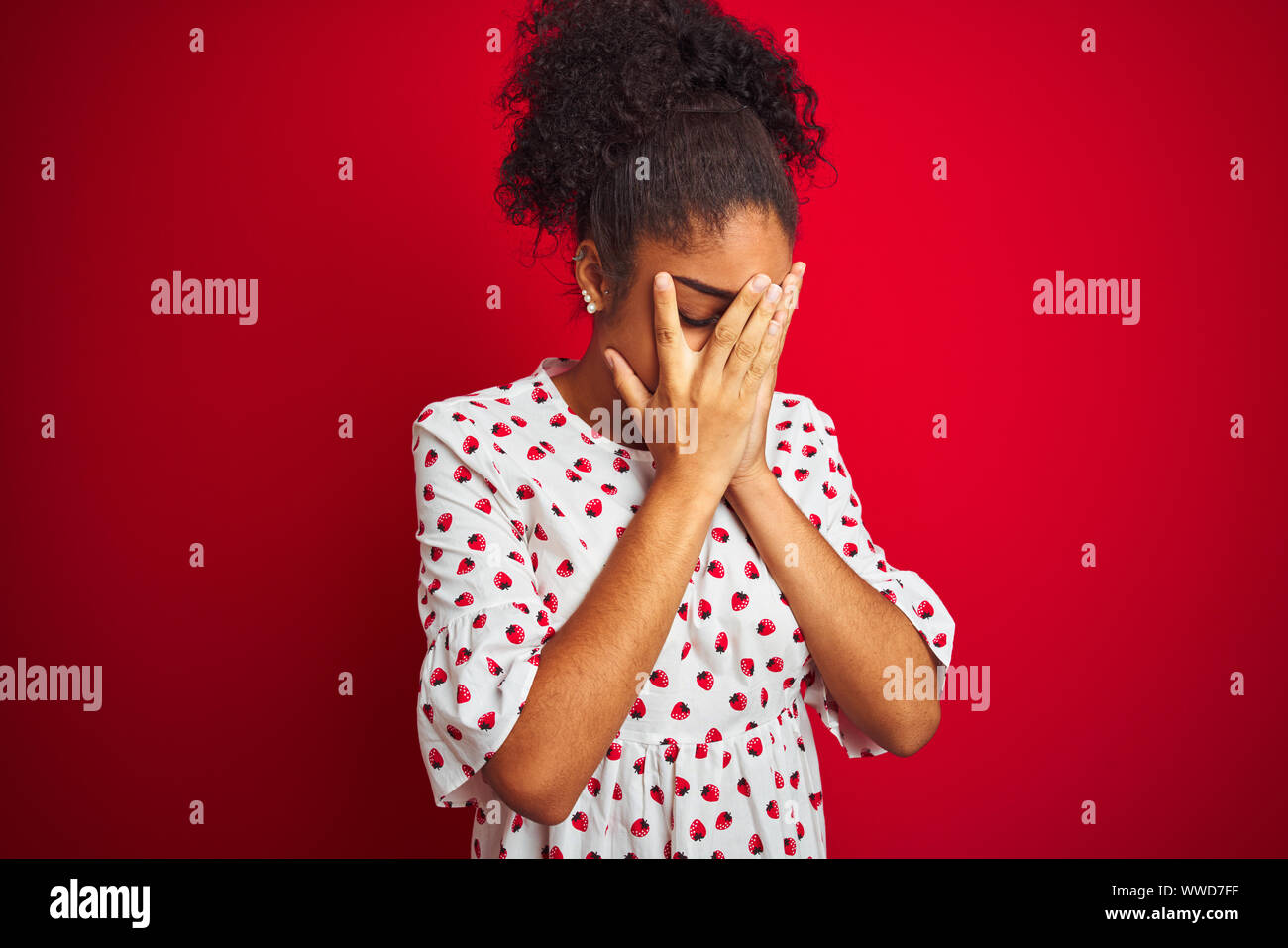 African american woman wearing fashion white dress standing over ...