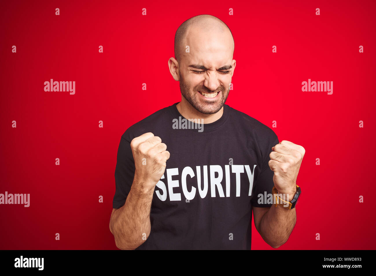 Young safeguard man wearing security uniform over red isolated ...