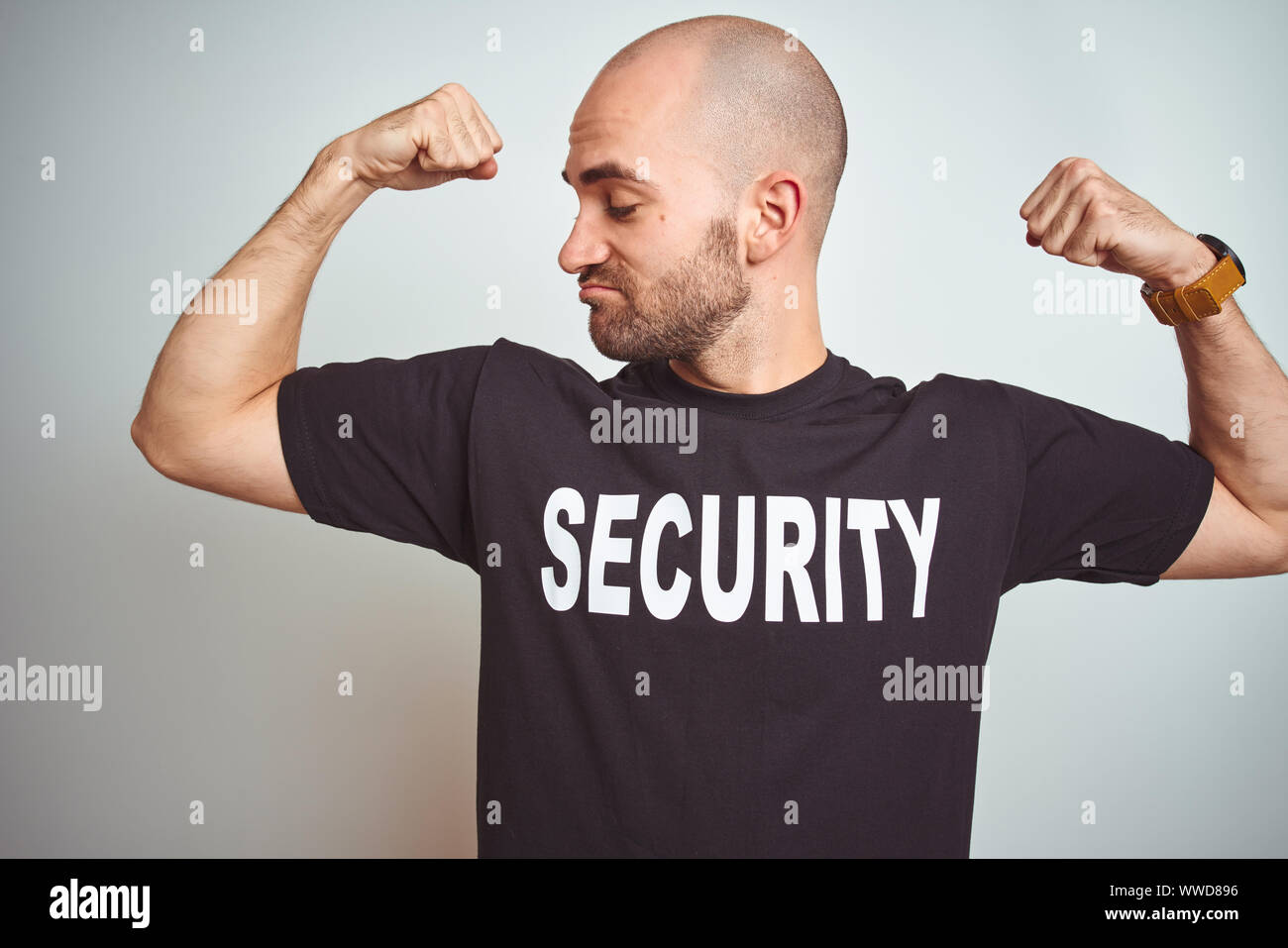 Young safeguard man wearing security uniform over isolated background ...