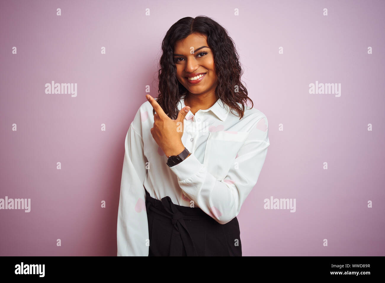 Transsexual transgender businesswoman standing over isolated pink ...