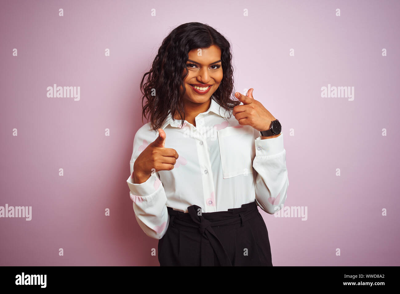 Transsexual transgender businesswoman standing over isolated pink ...