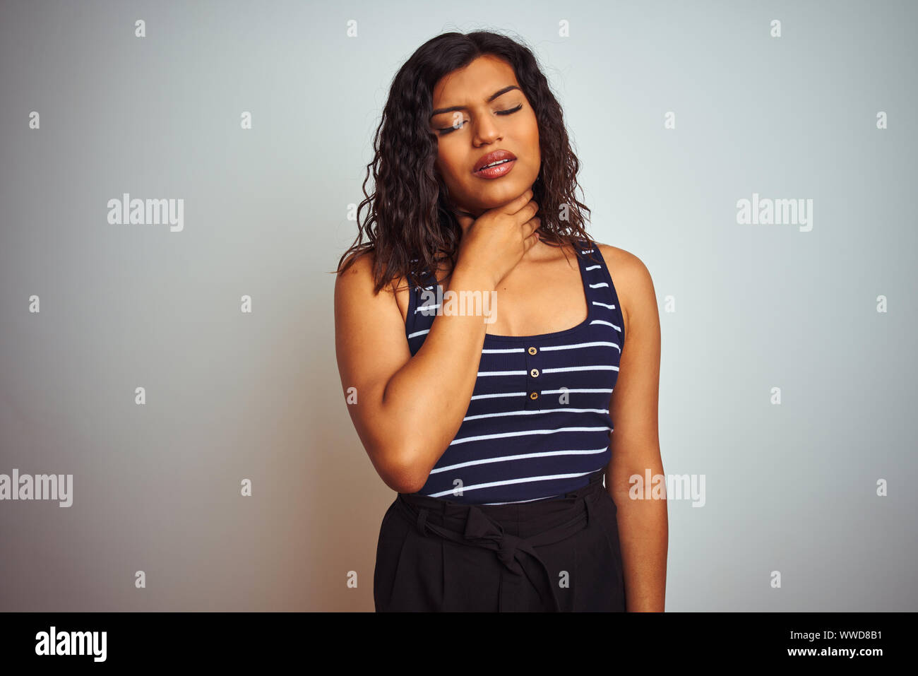 Transsexual transgender woman wearing striped t-shirt over isolated ...