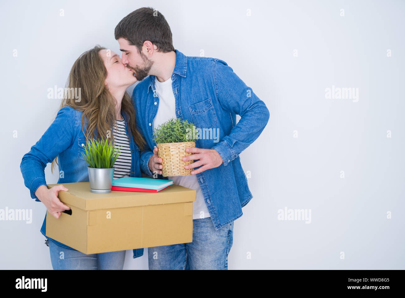 Young Beautiful Couple Holding Cardboard Boxes Very Happy For Moving To
