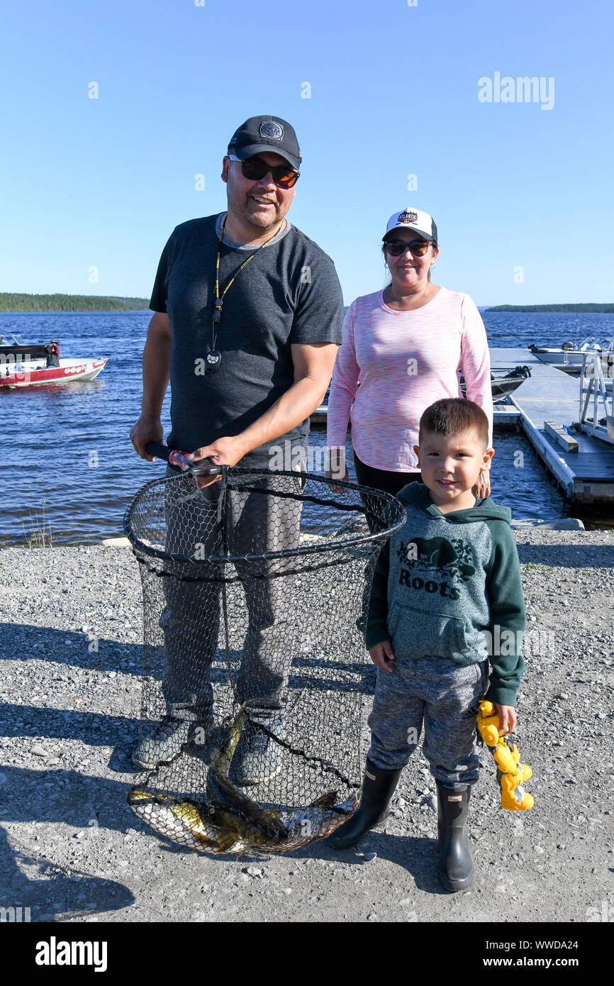 Indigenous family participating in a fishing derby, Northern Quebec ...