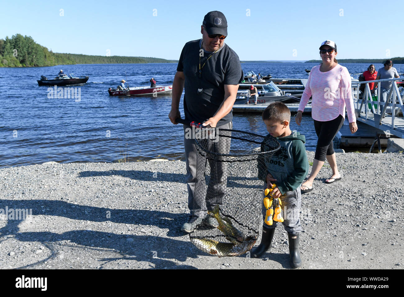 Indigenous family participating in a fishing derby, Northern Quebec ...