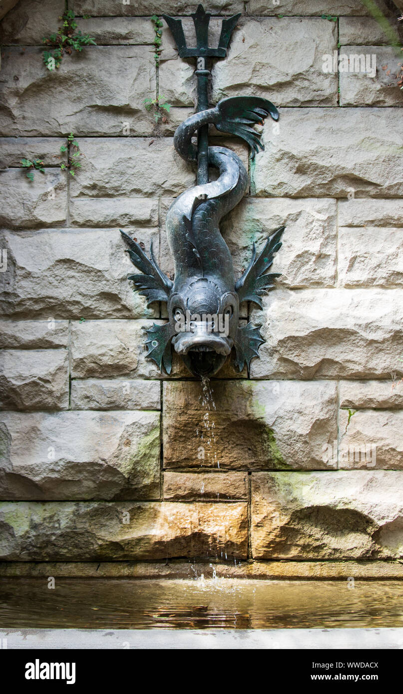 Water spurts out of a dragon-fish gargoyle at the Biltmore Estate in ...
