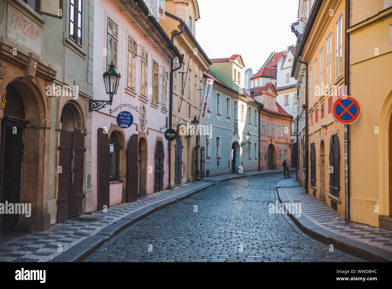 empty street in european city with woman bicyclist in the end Stock ...