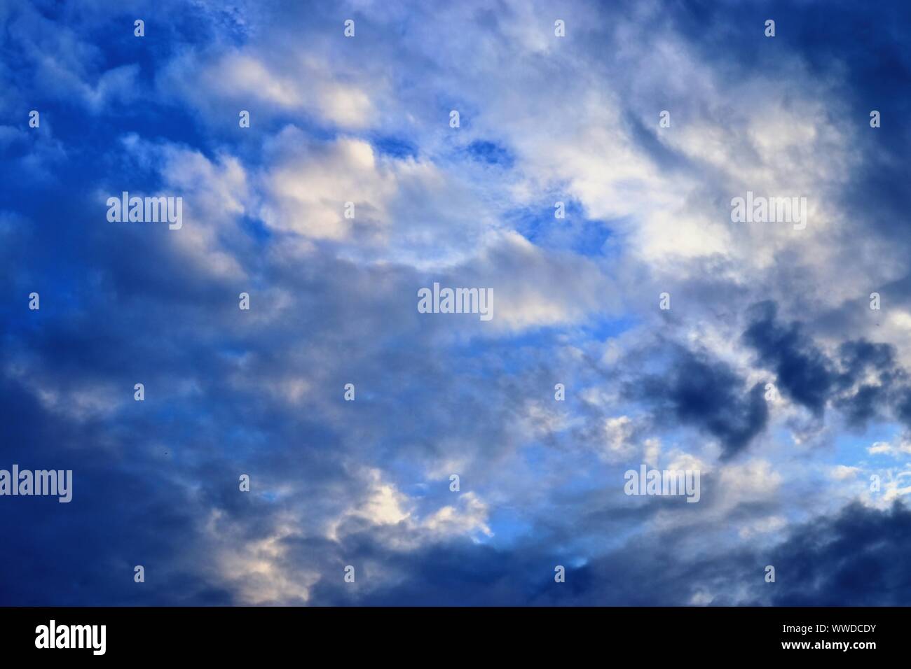Stunning mixed cloud formation panorama on a deep blue summer sky Stock ...