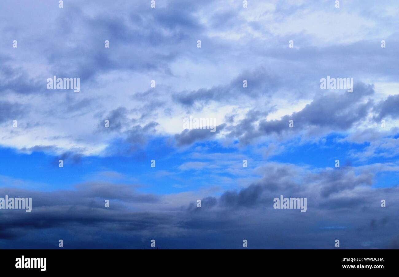 Stunning mixed cloud formation panorama on a deep blue summer sky Stock ...