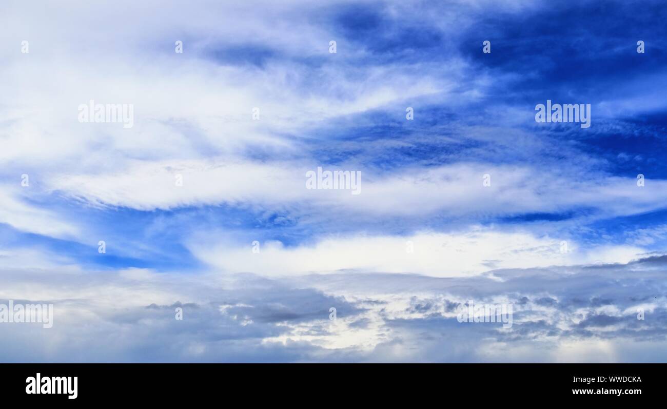 Stunning mixed cloud formation panorama on a deep blue summer sky Stock ...