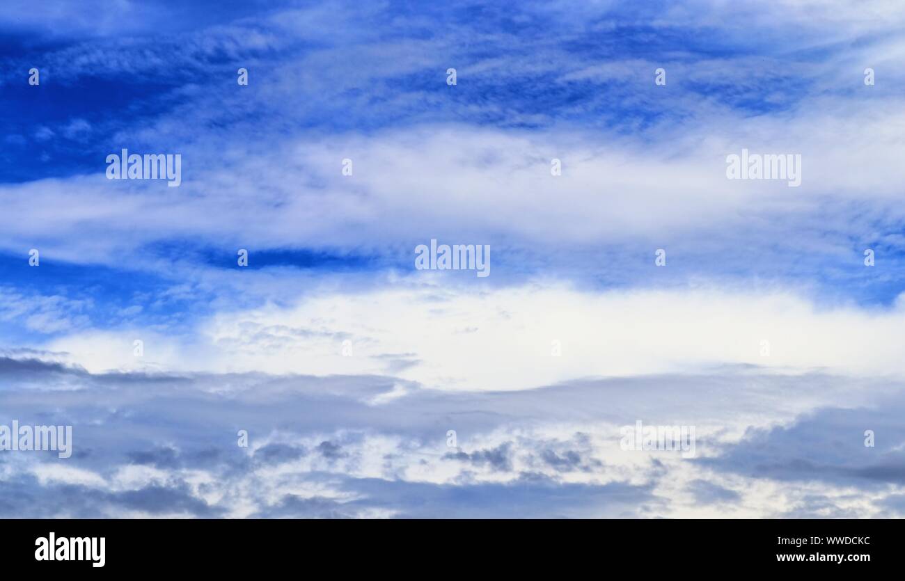 Stunning mixed cloud formation panorama on a deep blue summer sky Stock ...