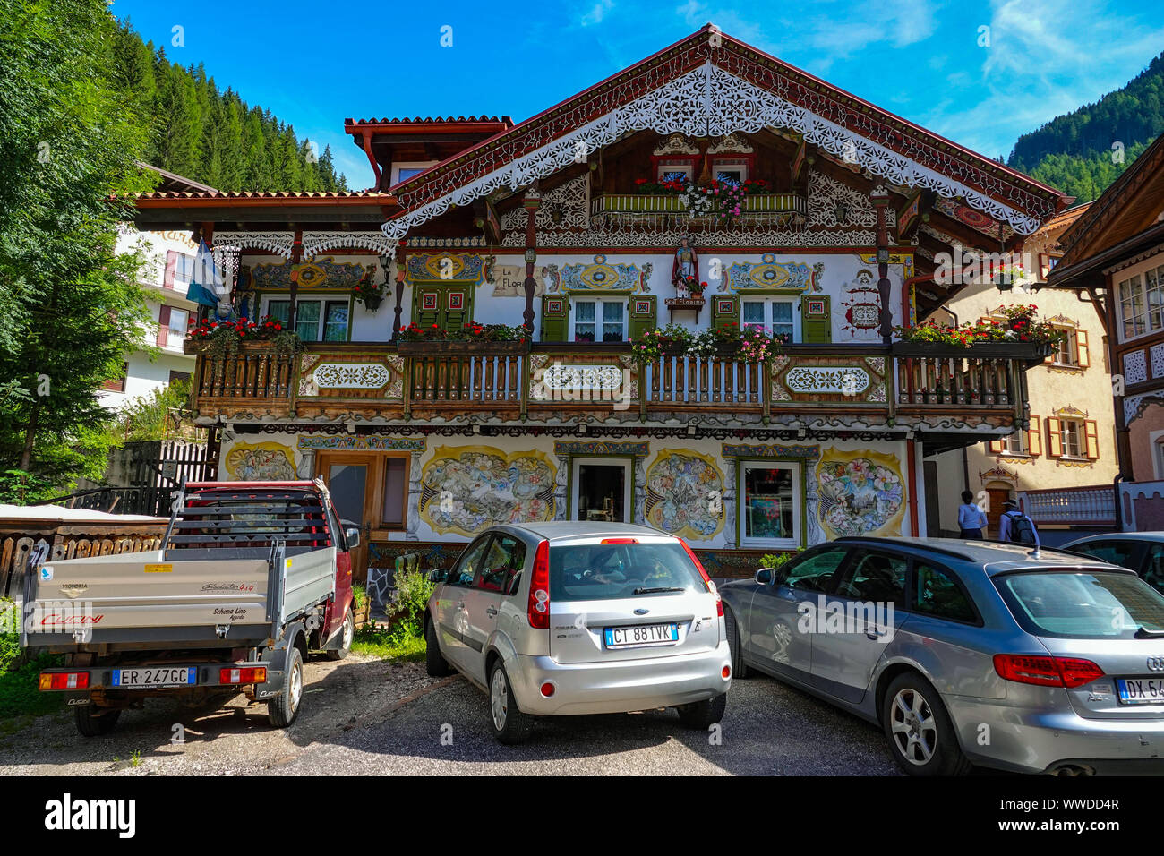Fancy wooden painted buildings, the Italian Dolomites around Canazei ...