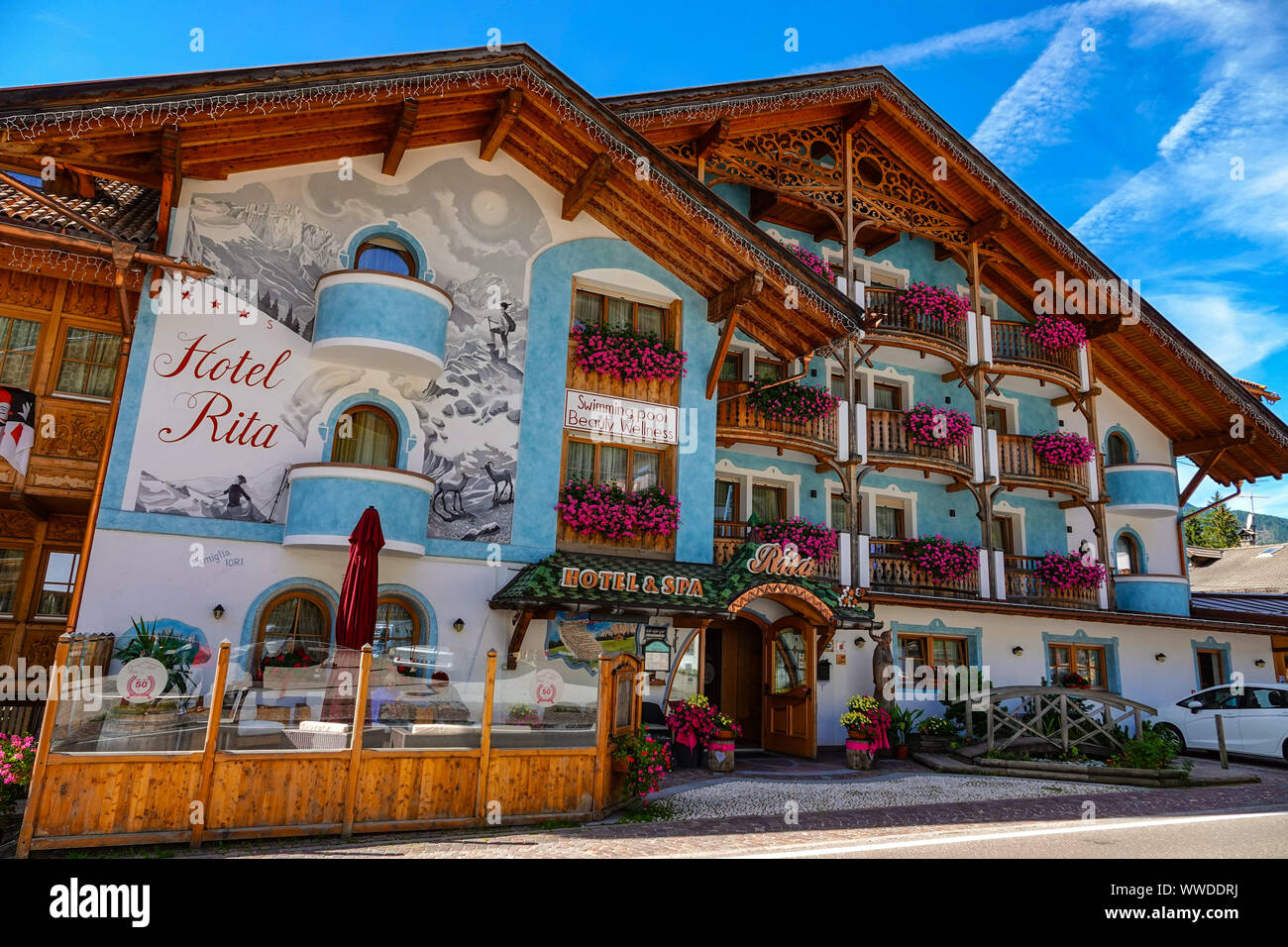 Fancy wooden painted buildings, the Italian Dolomites around Canazei ...