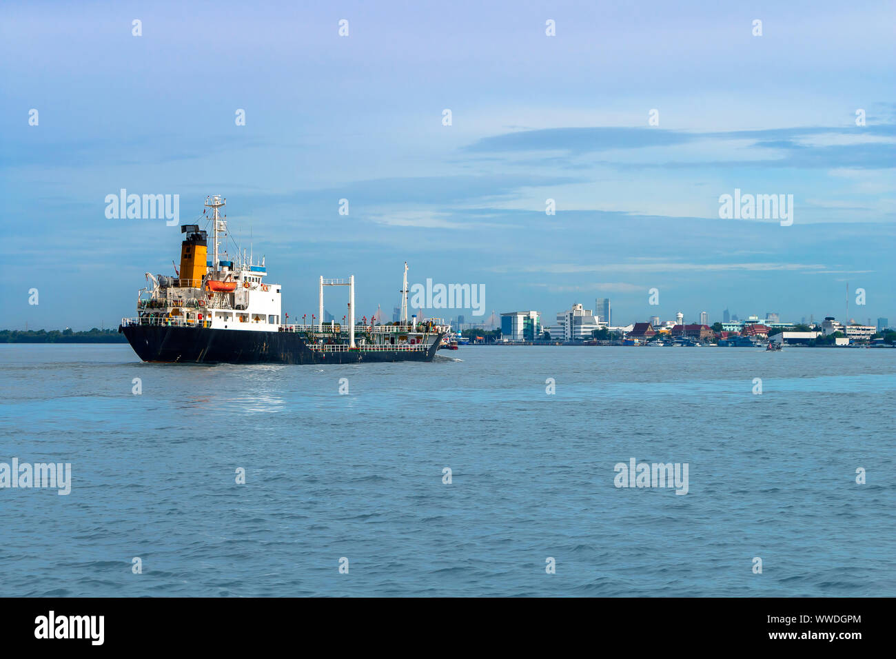 Cargo Ship Back to the pier Stock Photo - Alamy