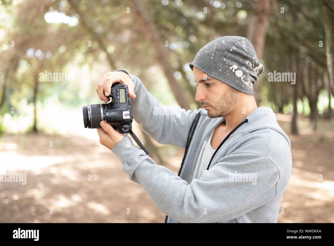 casual man photographer shooting pictures and video edit Stock Photo ...