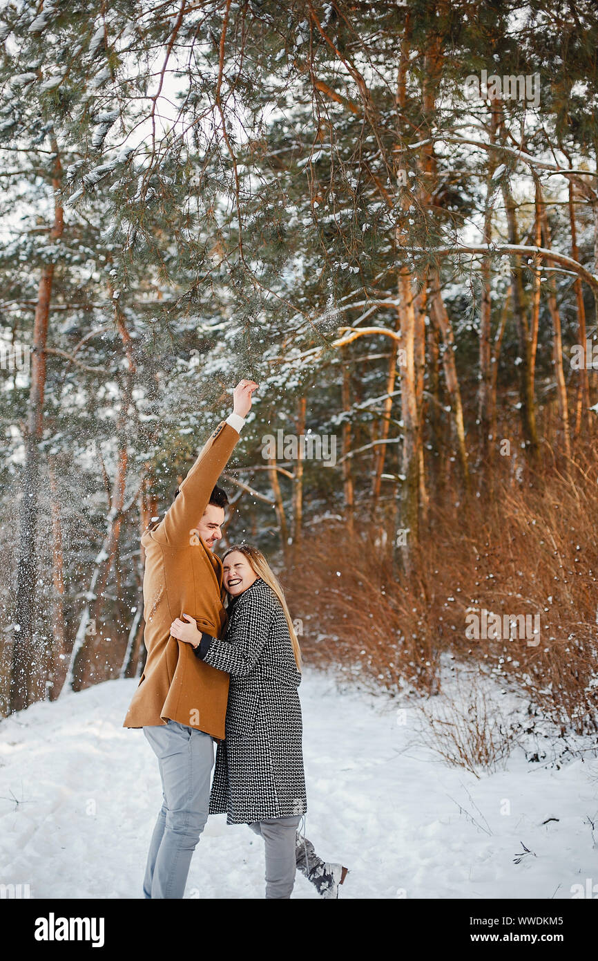 happy couple playing with snow in the park Stock Photo - Alamy