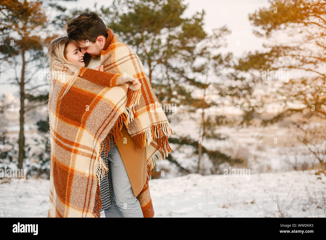 Couple wrapped in blanket outside hi-res stock photography and images ...