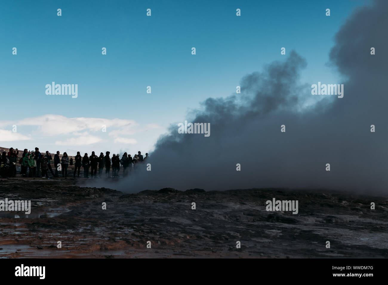Strokkur geyser with tourist crowd in the background, Iceland Stock ...