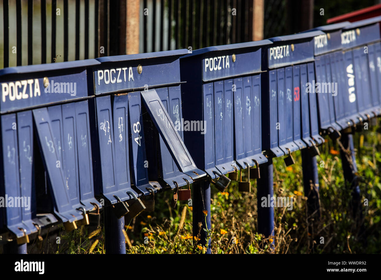 blue letterboxes with numbers and locks Stock Photo - Alamy