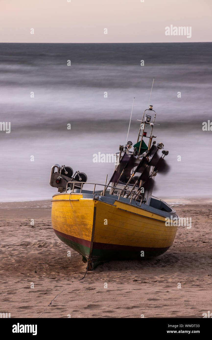 yellow ship at the beach Stock Photo - Alamy