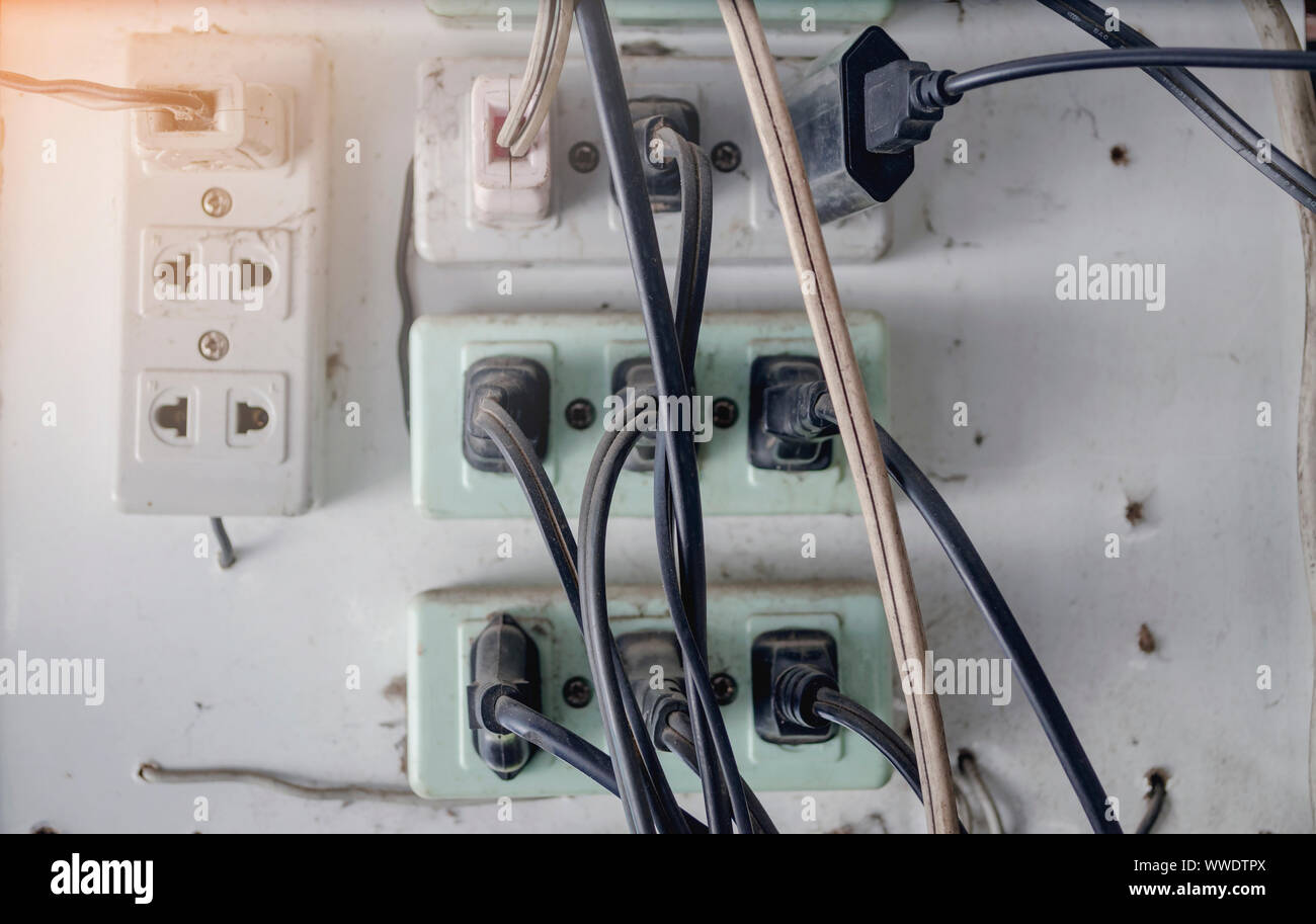 Multi old vintage electric splitter with sockets and wires with plugs ...