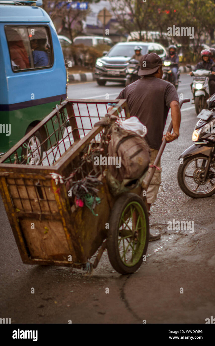 Street man pulls cart hi-res stock photography and images - Alamy