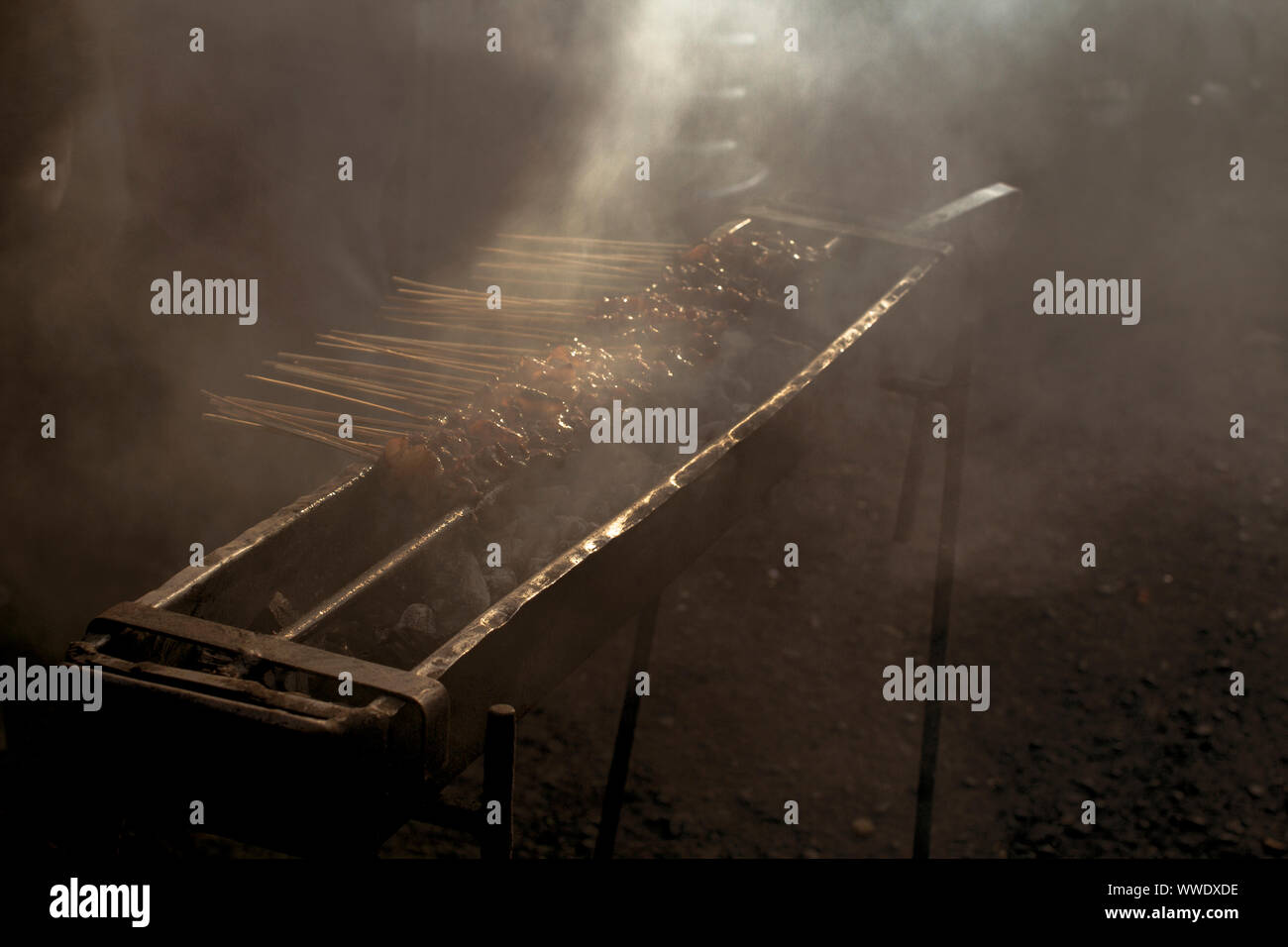 Chicken satay grill at a busy street food market Stock Photo - Alamy