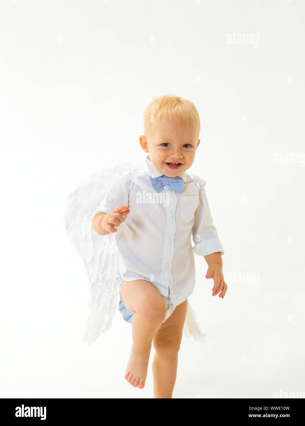 Lets celebrate. Adorable little angel boy. Baby angel. Little boy with ...