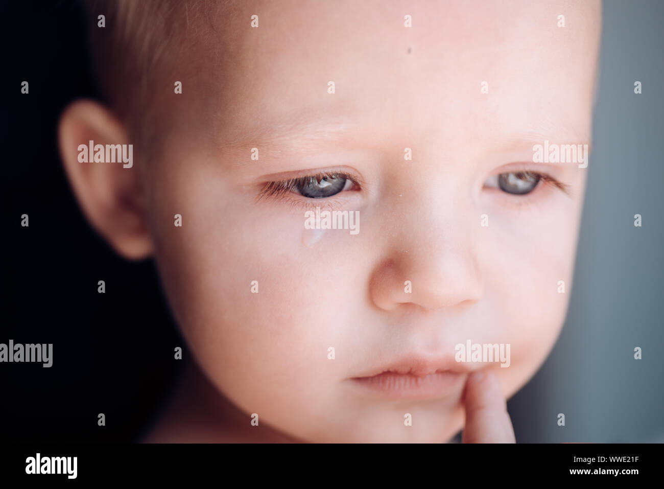 Tear rolling down face hi-res stock photography and images - Alamy