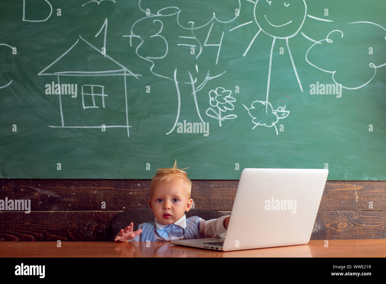 Little boy study in school using laptop. Study computer science or ...