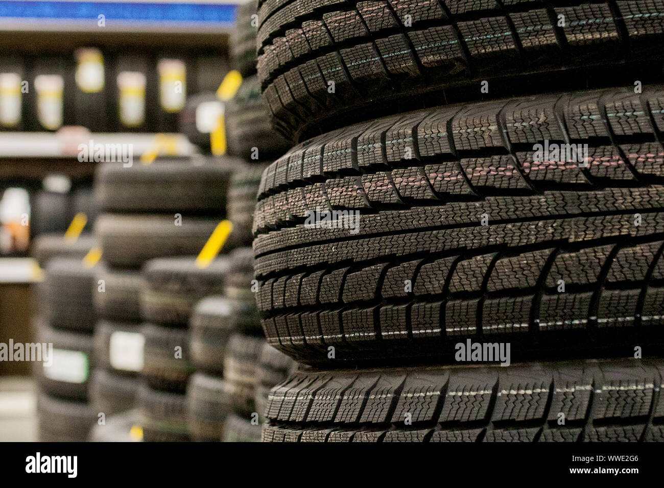 Car tires and wheels at warehouse in tire store Stock Photo - Alamy