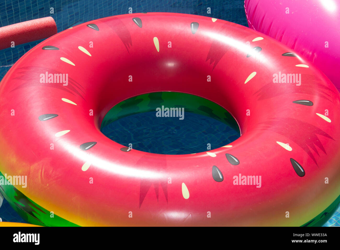 inflatable melon ring floating in swimming pool Stock Photo - Alamy