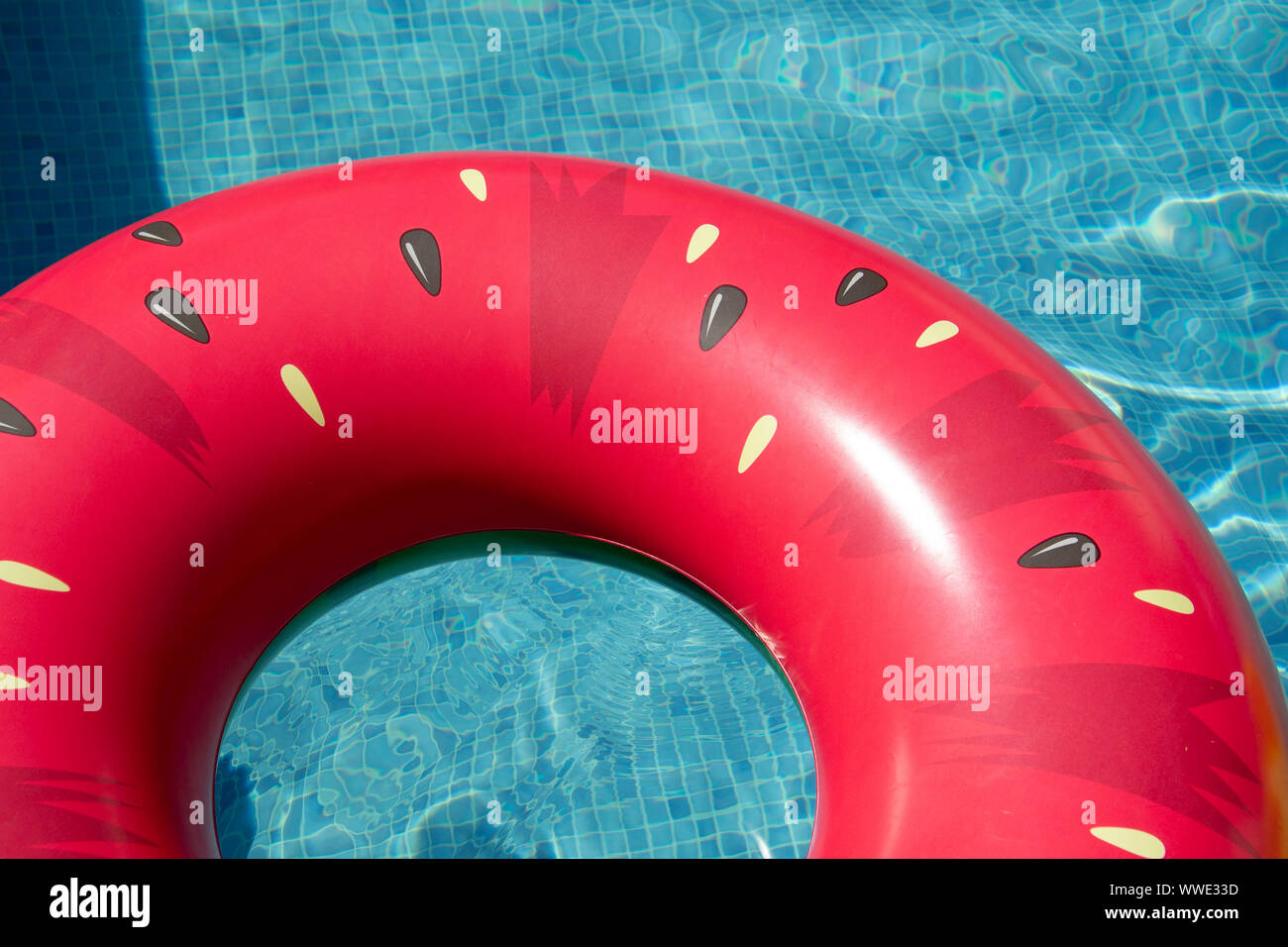 inflatable melon ring floating in swimming pool Stock Photo - Alamy