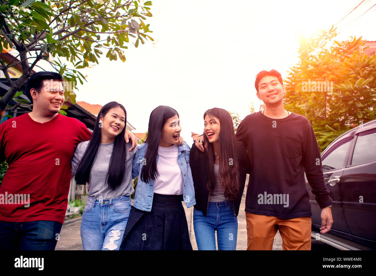 group of asian younger man and woman relaxing toothy smiling face with ...
