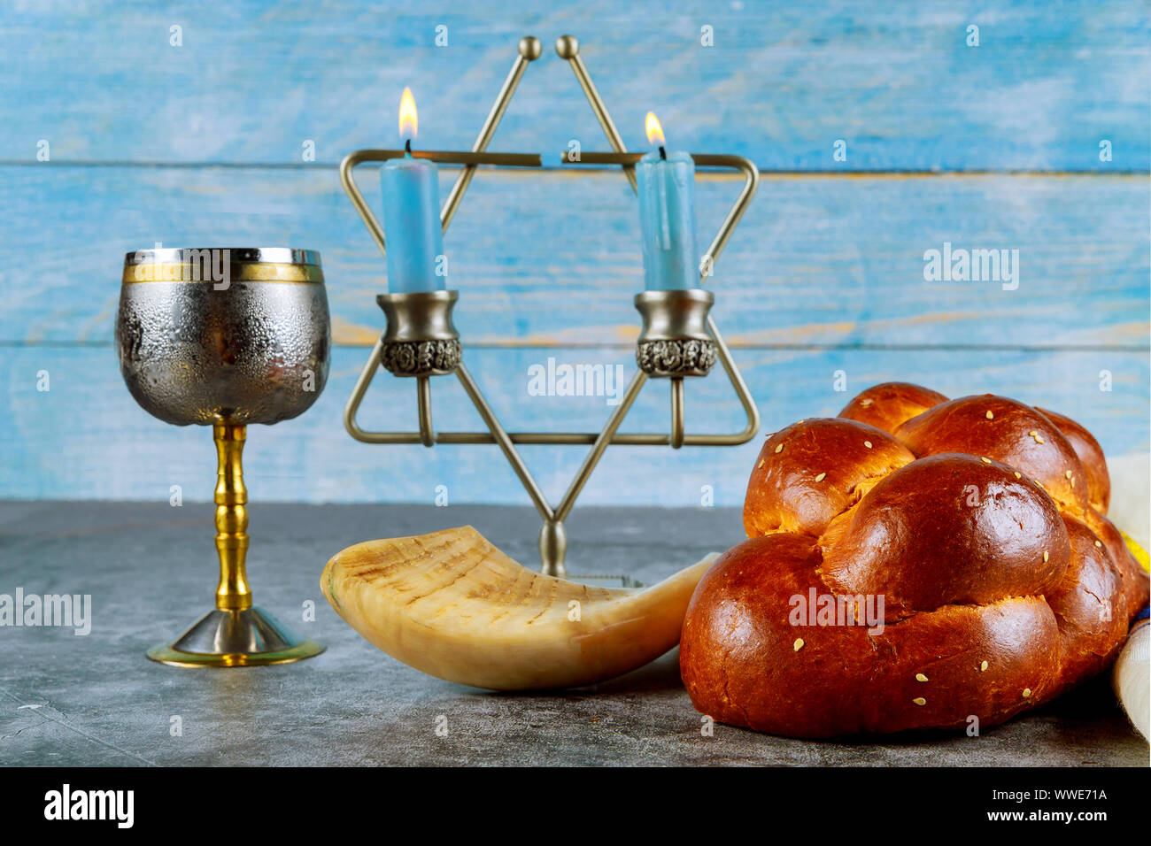 Shabbat challah bread, shabbat wine and candles on the table Stock ...