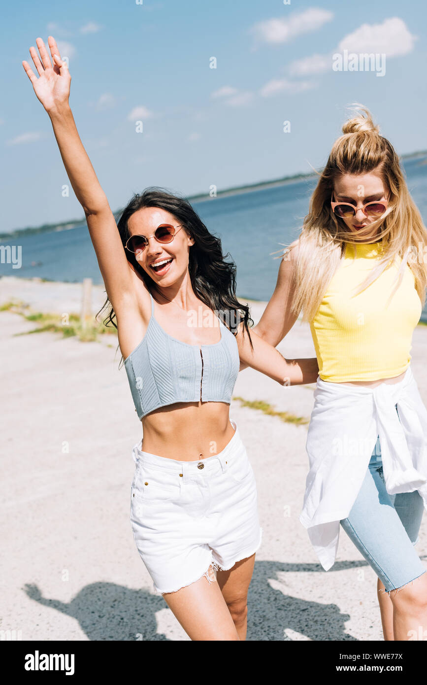 Girls walking together in the sunshine hi-res stock photography and ...