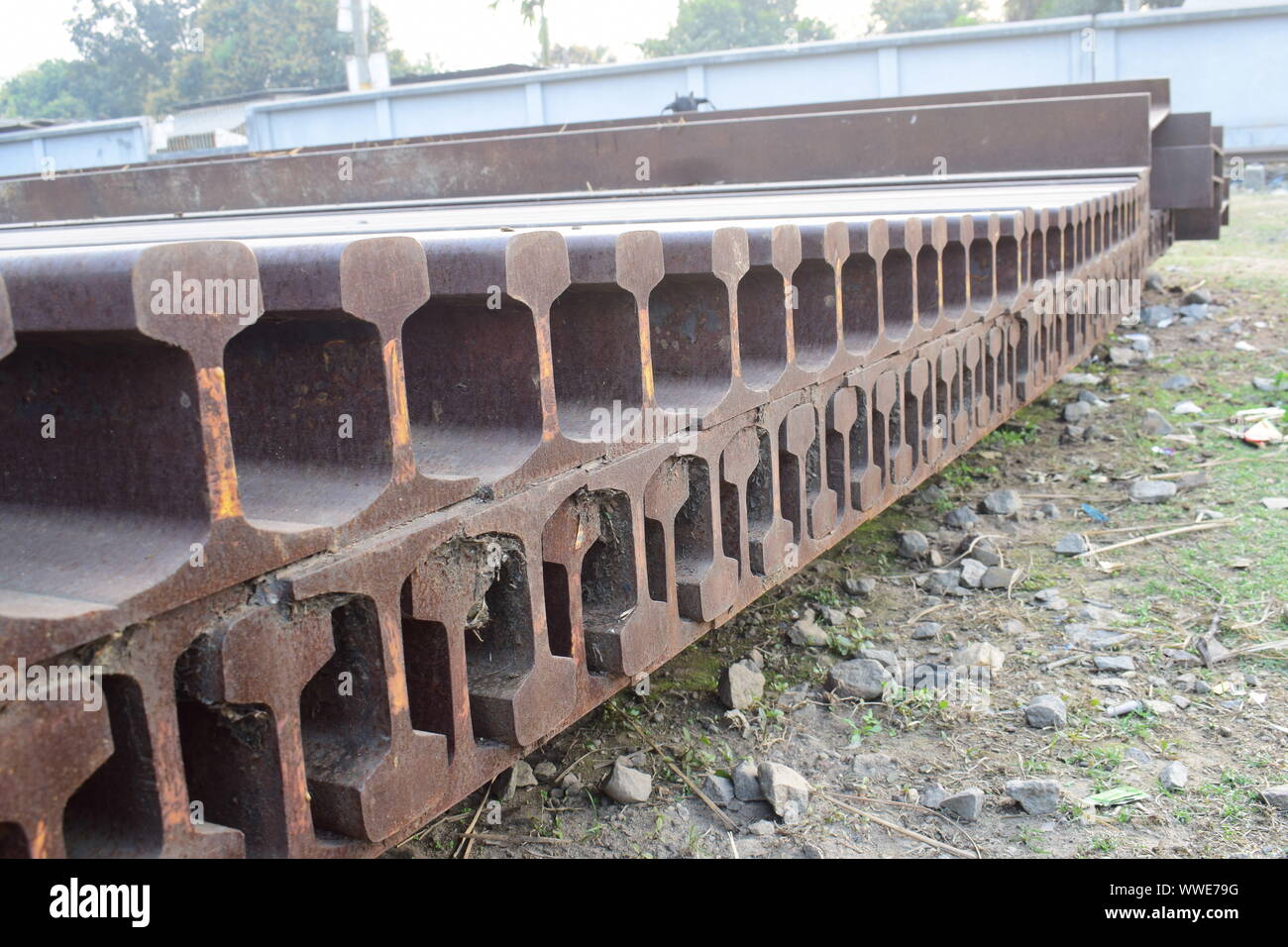 segments of railway tracks arranged in a pattern kept at the side of ...