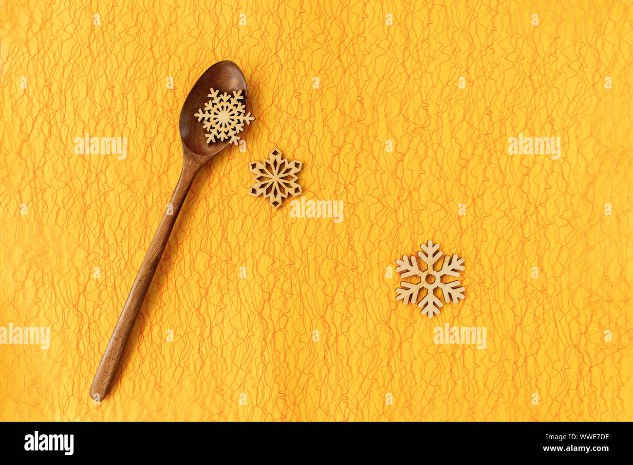 Christmas background with wooden spoon and snowflakes. Holiday cooking ...