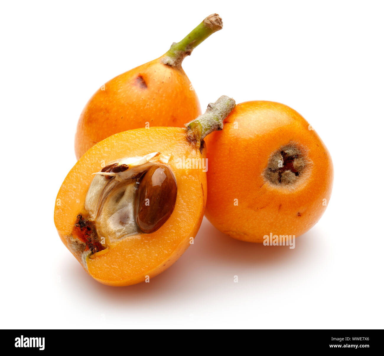 Group of ripe loquat fruits isolated on white background Stock Photo ...