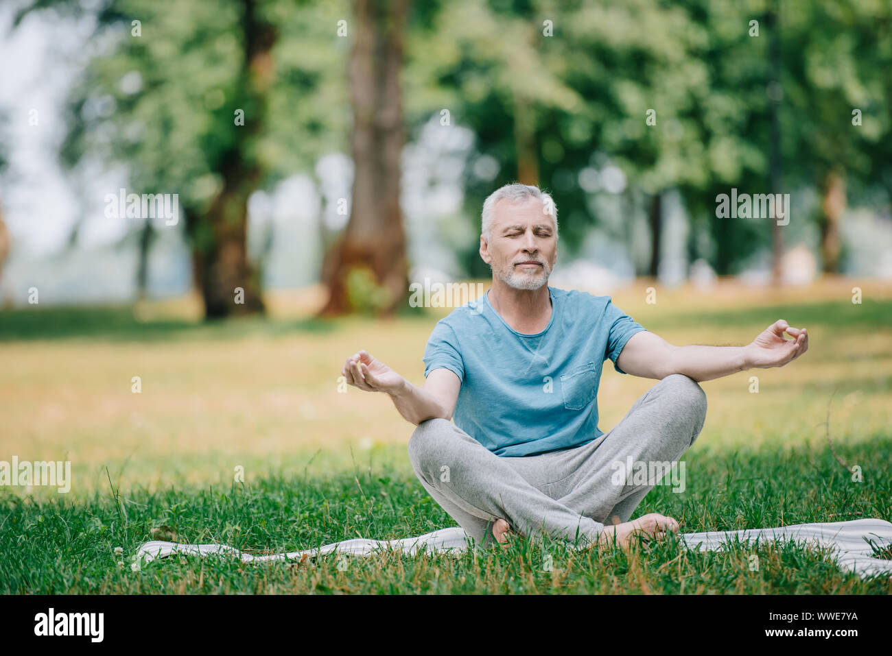Mature man in lotus pose hi-res stock photography and images - Alamy