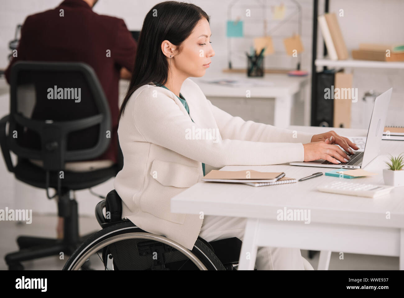 Concentrated disabled woman using hi-res stock photography and images ...