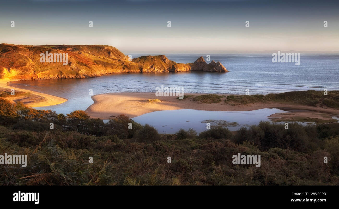 High tide at Three Cliffs Bay Stock Photo - Alamy