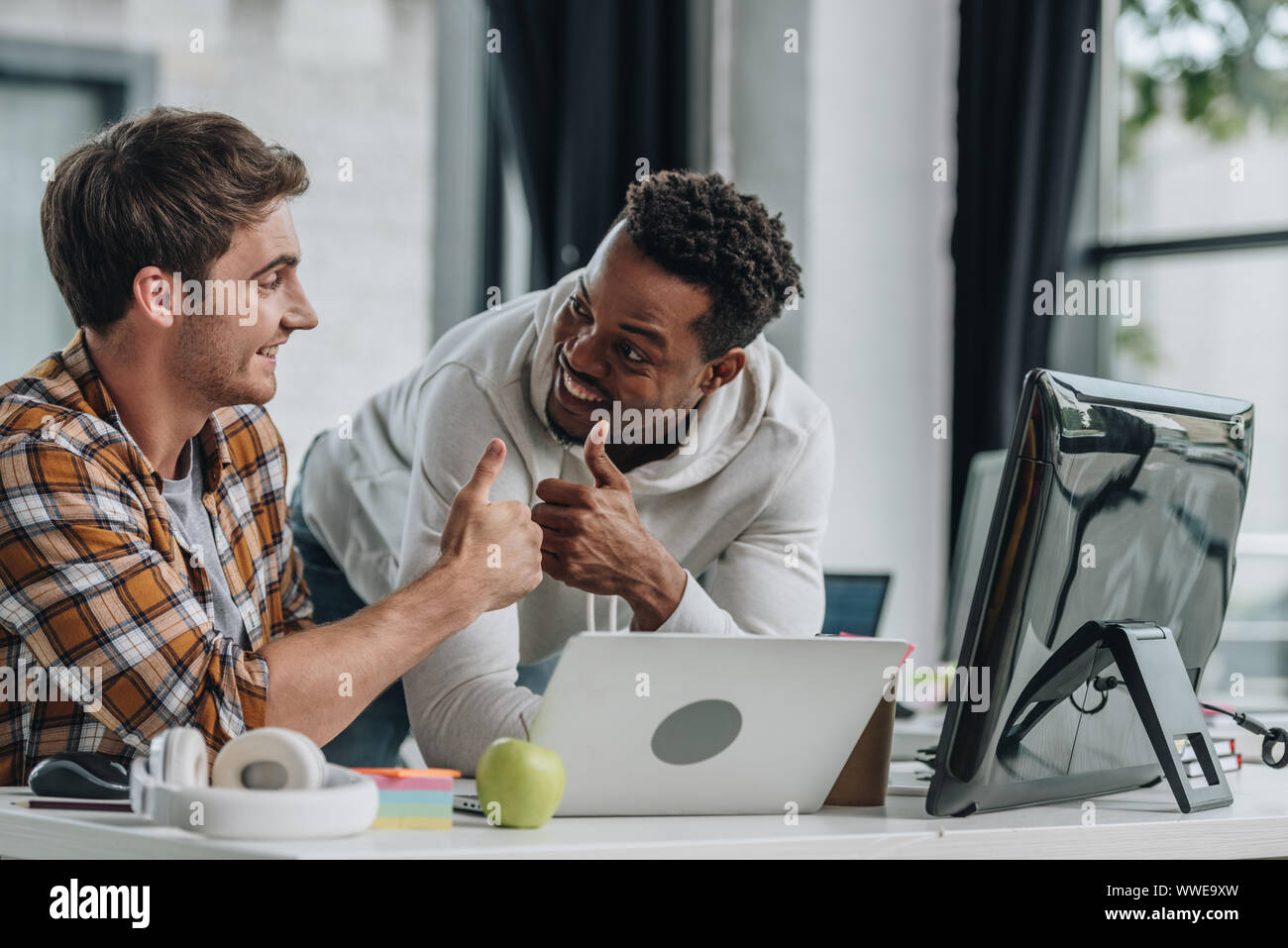 Developers at computer with headphones hi-res stock photography and images - Alamy