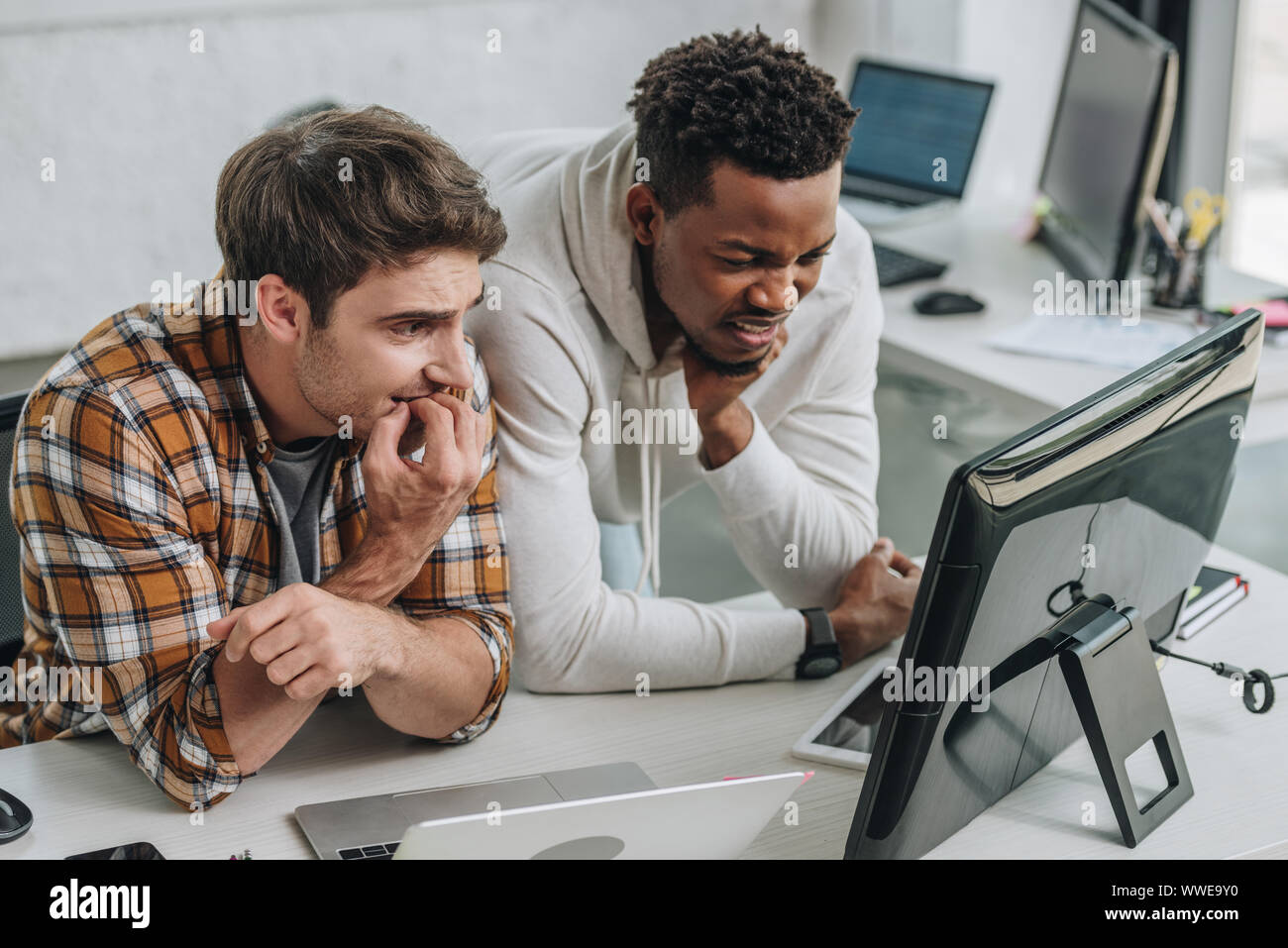 Team young programmers gadgets hi-res stock photography and images - Alamy