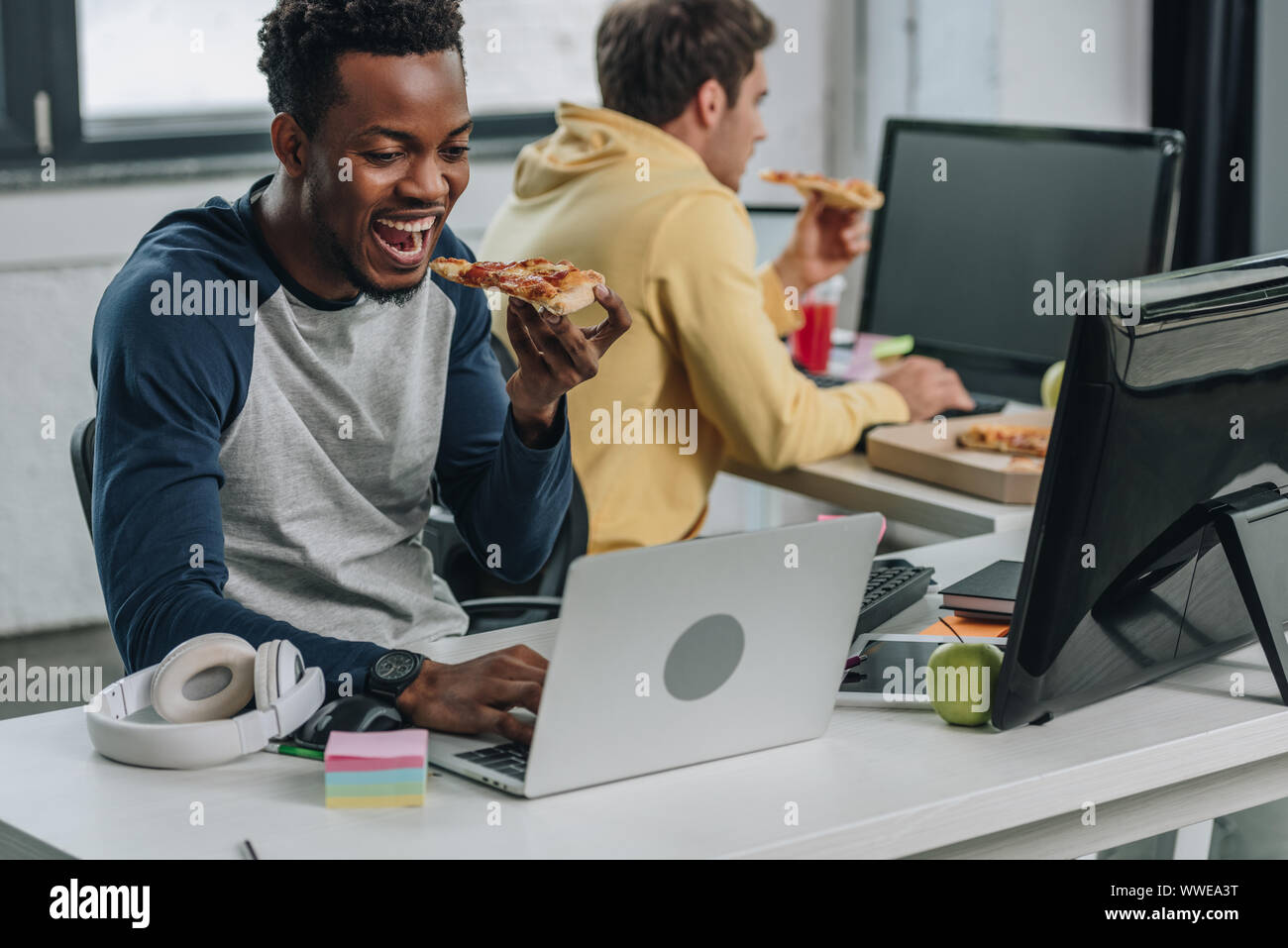Two young multicultural programmers hi-res stock photography and images ...