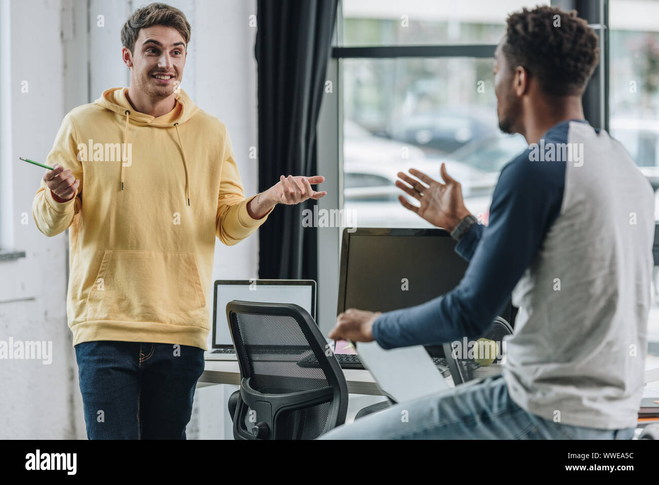 Team young programmers gadgets hi-res stock photography and images - Alamy